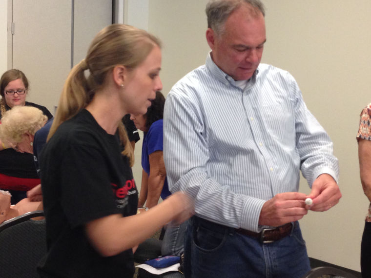 Kaine trains with others on procedure for anti-overdose drug