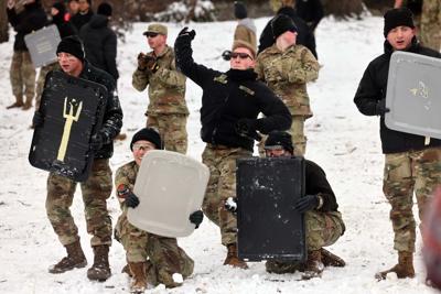 Photos: Tuesday's snow, including an epic snowball battle at Virginia Tech