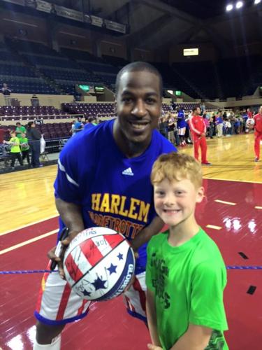 Photo: Logan Sword gets photo opp with a Harlem Globetrotter