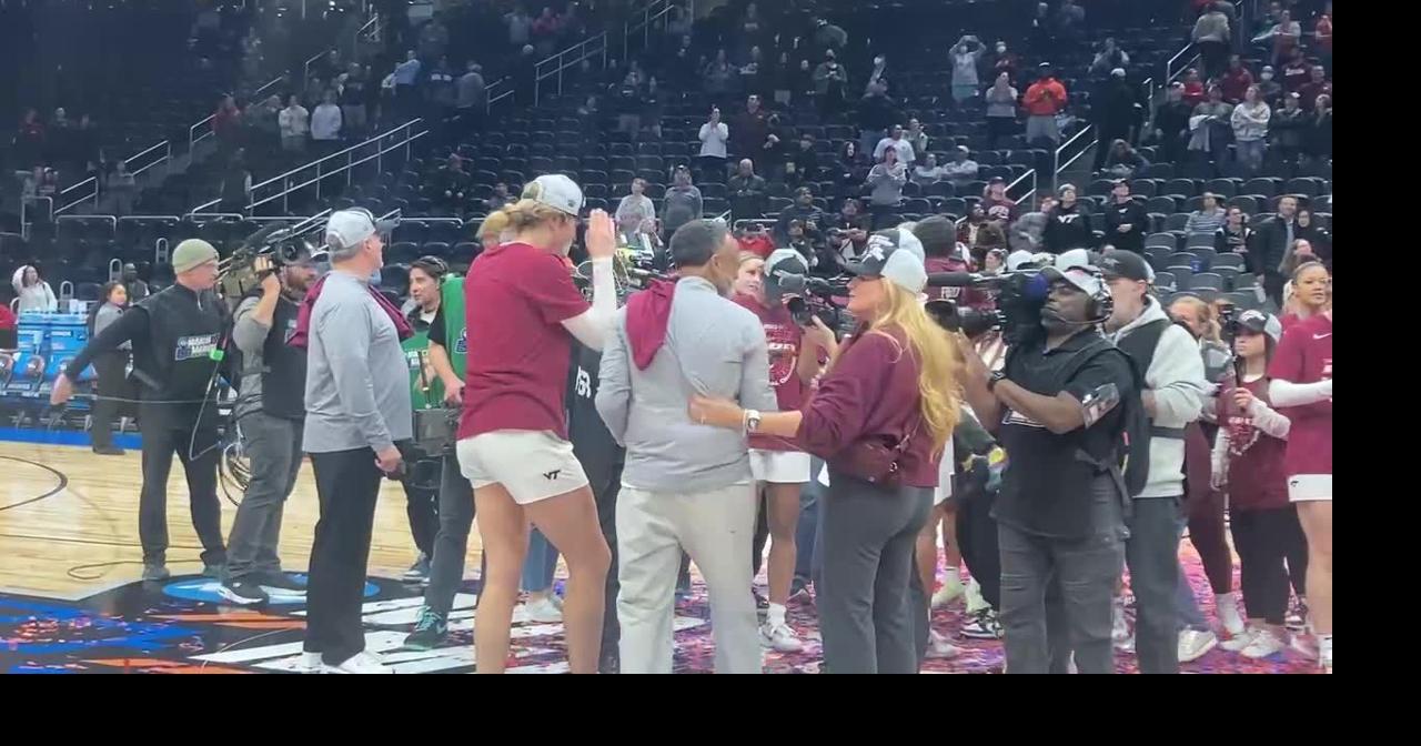 Kenny Brooks hugs Elizabeth Kitley and his wife
