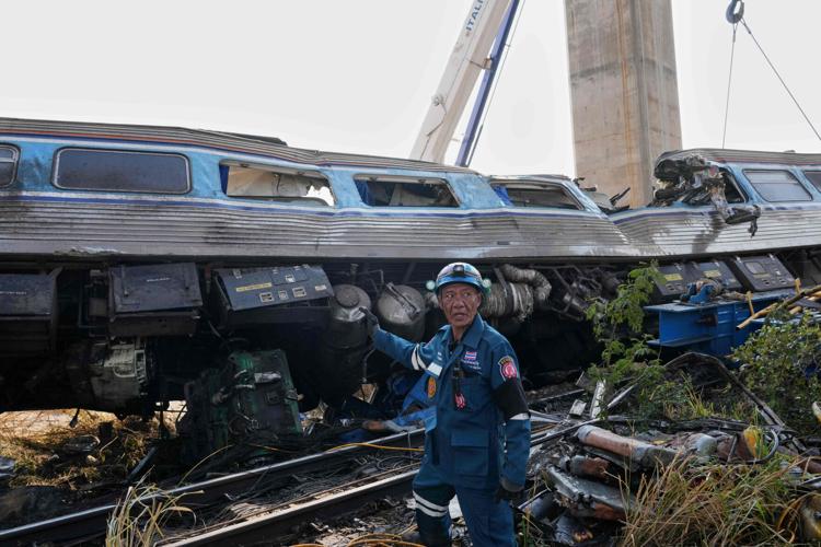 A construction crane falls onto a moving train in Thailand, killing at ...