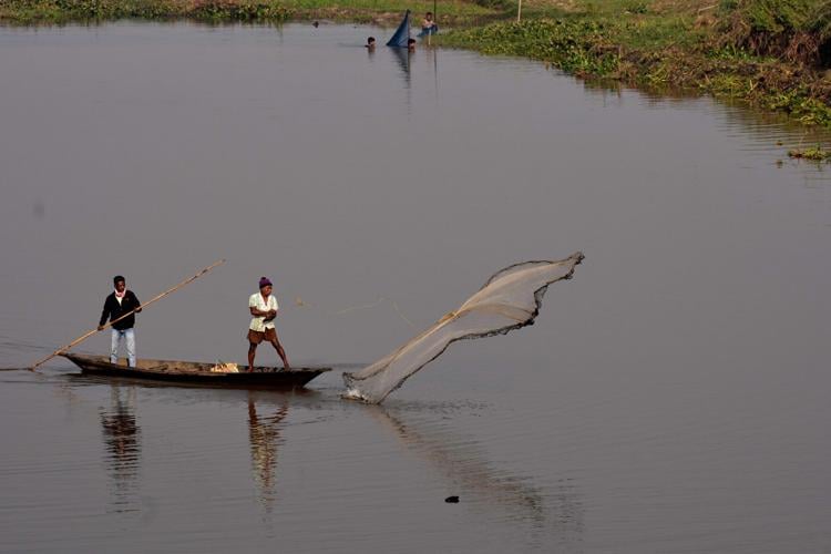 Photos of a community catch in an Indian fishing village marking the ...