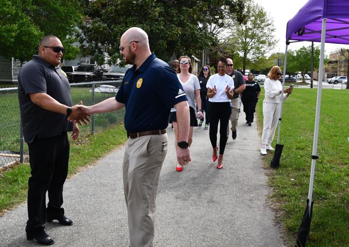 Walk in Her Shoes event calls attention to domestic violence | Local ...