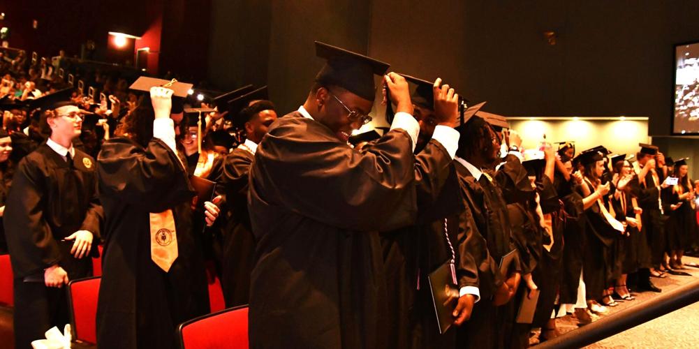Graduates turn tassels with special recognition honoring slain student ...