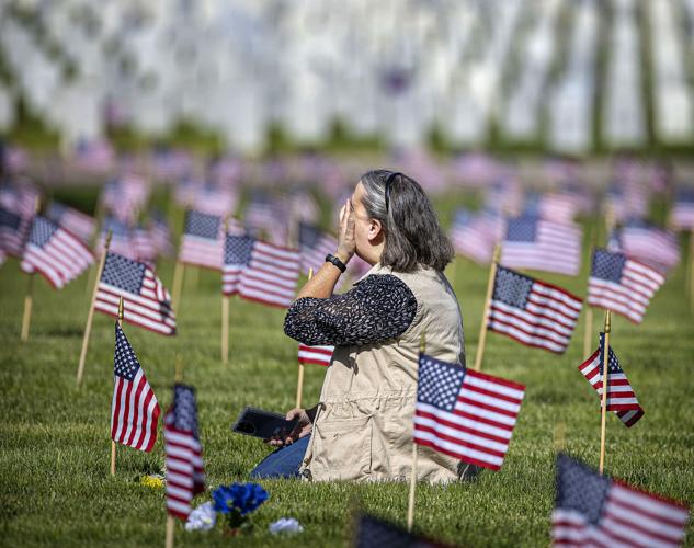 Volunteers who decorate cemetery for Memorial Day hope holiday 'a time ...