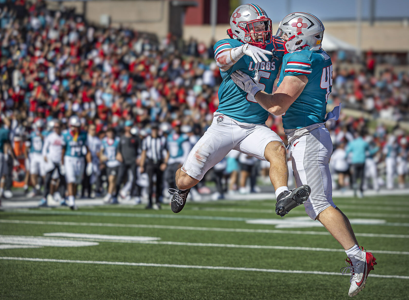 Lobos' Eck named Mountain West Coach of the Year; son Jaxton shares ...