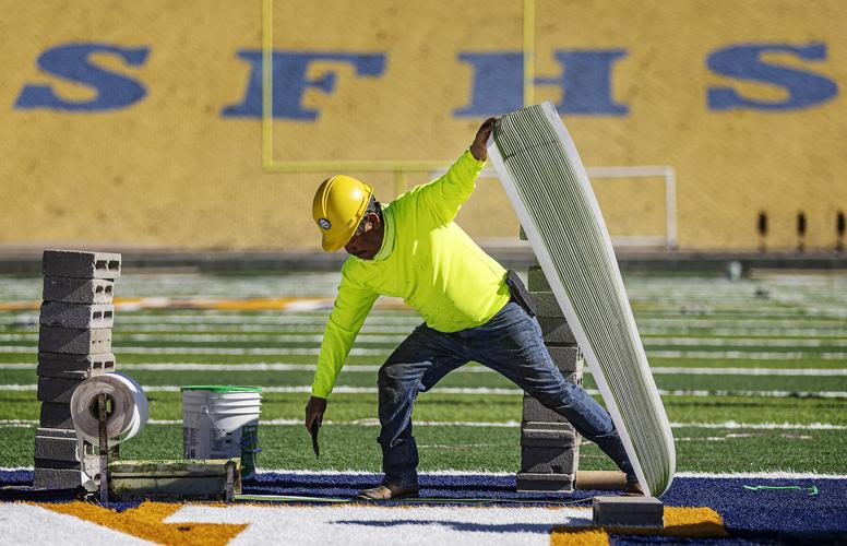 Final touches being made to new football turf at Ivan Head Stadium ...