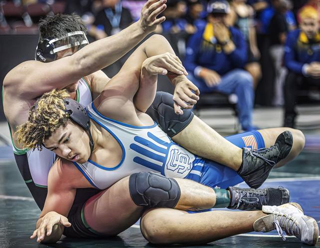 One of the state's top wrestlers has his eyes on a Santa Fe High legend ...