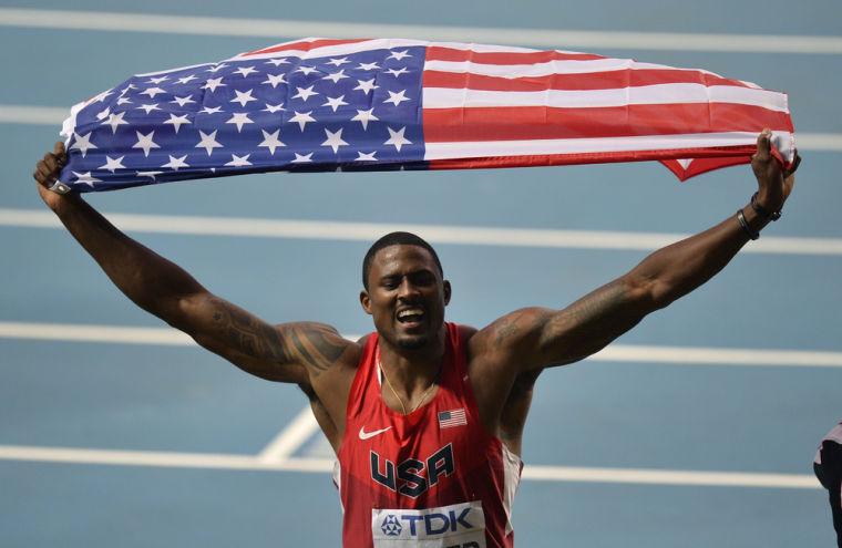 American David Oliver barrels over hurdles to win title at worlds ...