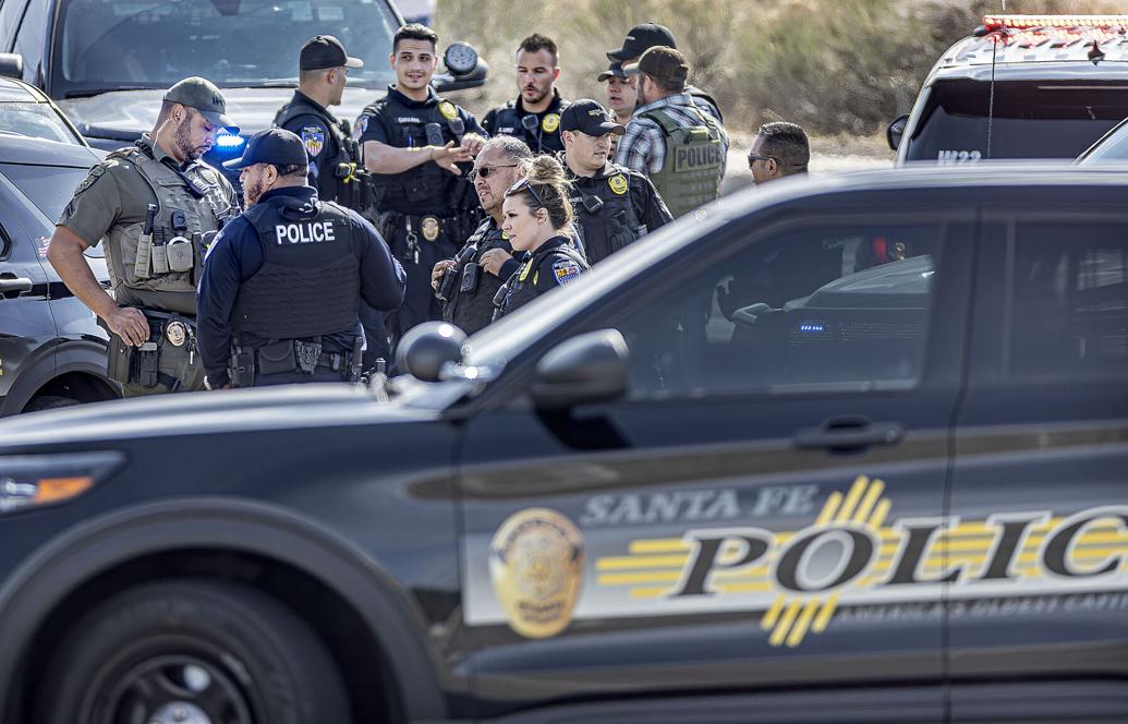 Santa Fe police rescue two people from inside moving truck after south ...