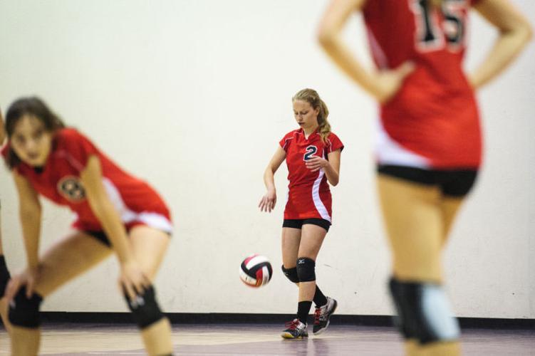 Twin volleyball players opt to play against each other on court ...