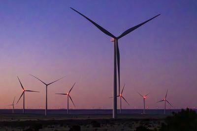 windmill on fire with two workers