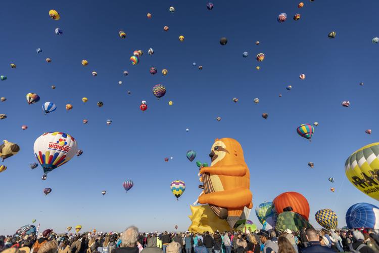 Albuquerque Balloon Fiesta gets off the ground with colorful pre-dawn ...