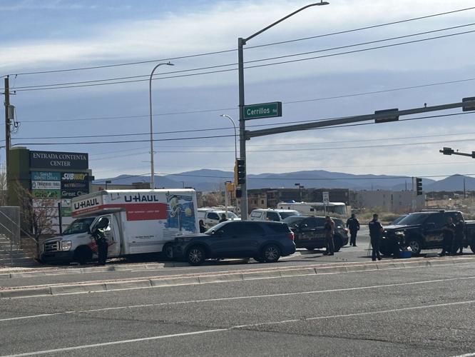 Santa Fe police rescue two people from inside moving truck after south ...