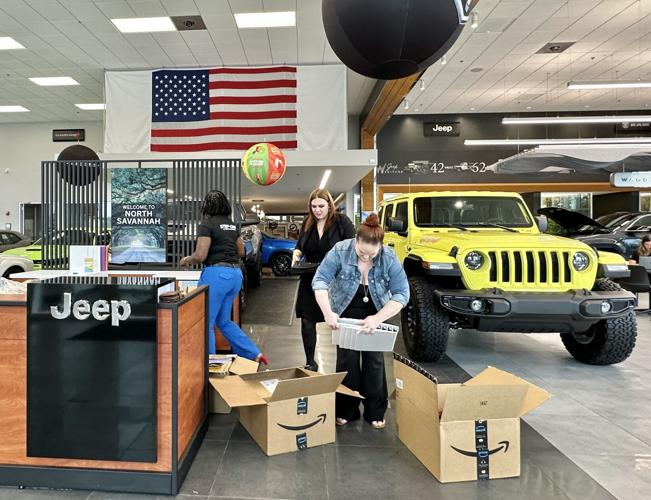 Step One Automotive Group Stuff the Bus with United Way | Photos ...