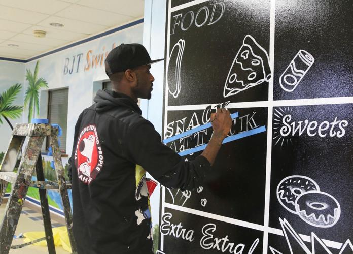 Artists paint murals at Timmonsville schools