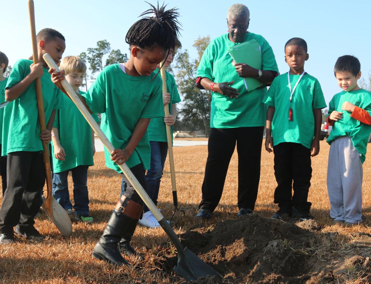 Students at Florence elementary school plant trees for Arbor Day