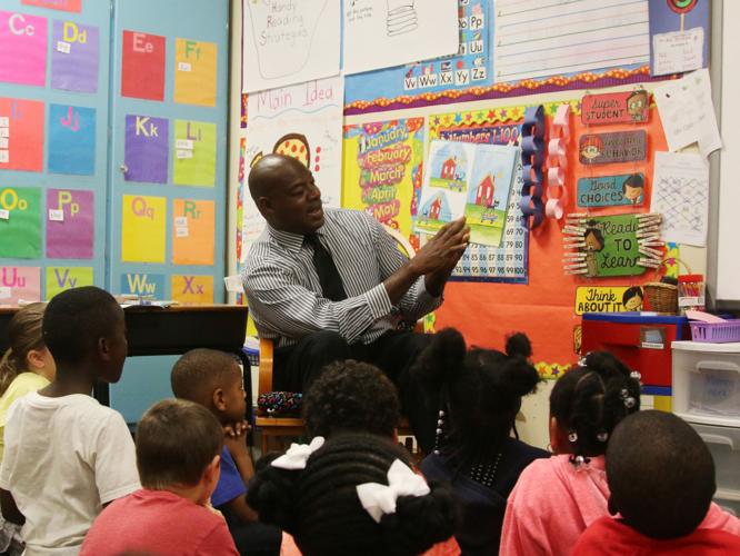 'Real Men Read': Visitors set example at elementary school in Florence