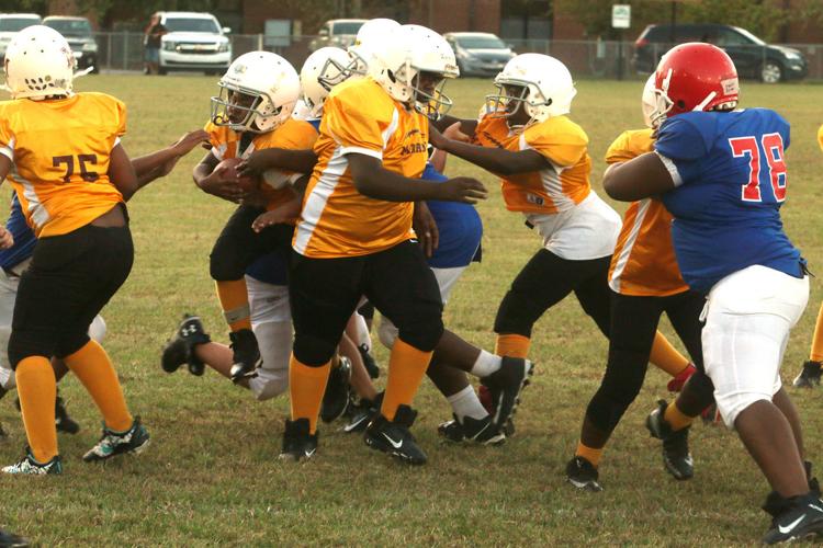 Marion hosts youth football game action against Mullins