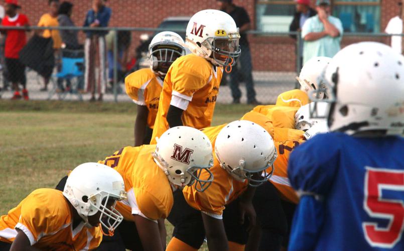 Marion hosts youth football game action against Mullins