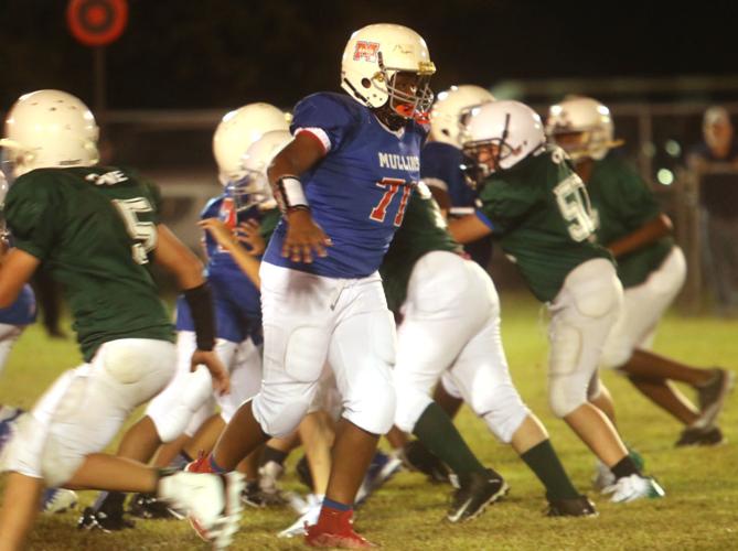 Marion hosts youth football game action against Mullins