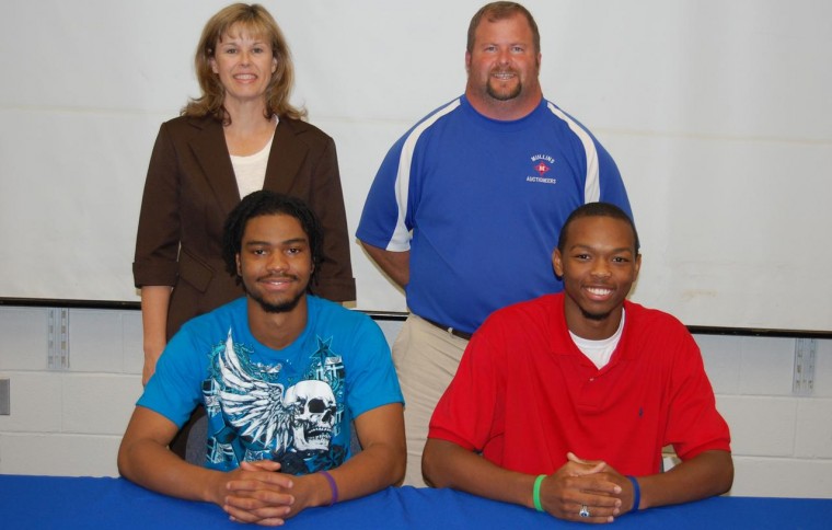 Mullins High School students sign to play college football