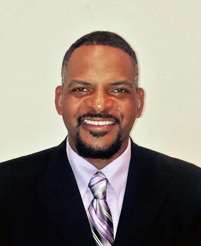 Howard hired as Wilson's third football coach in three years