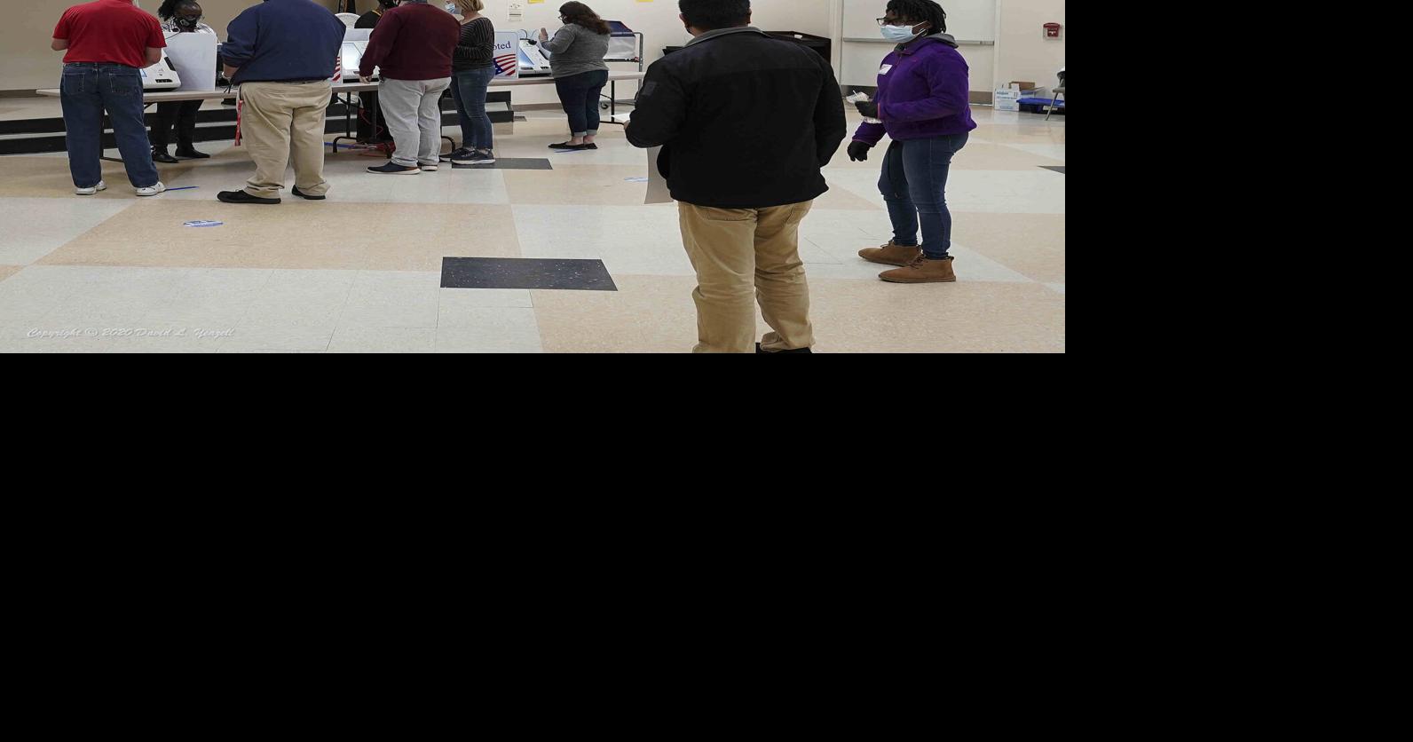 Voters line up to vote, election officials start counting the votes