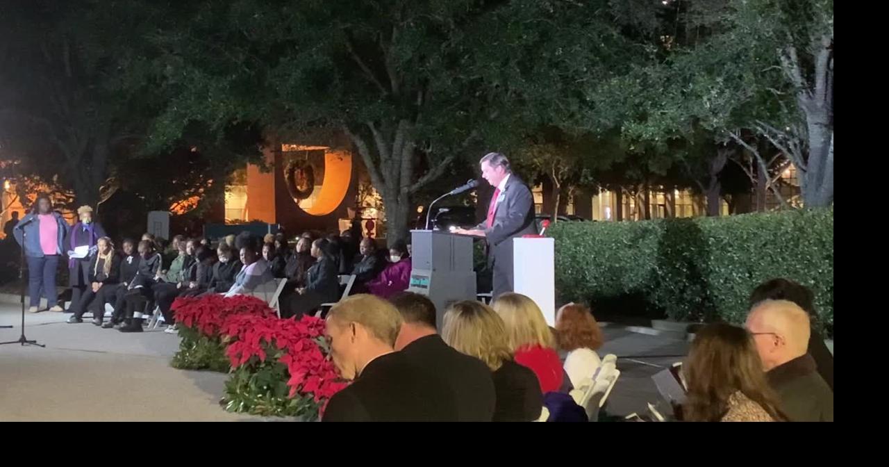 McLeod Hospice Tree Lighting a sign Christmas is here