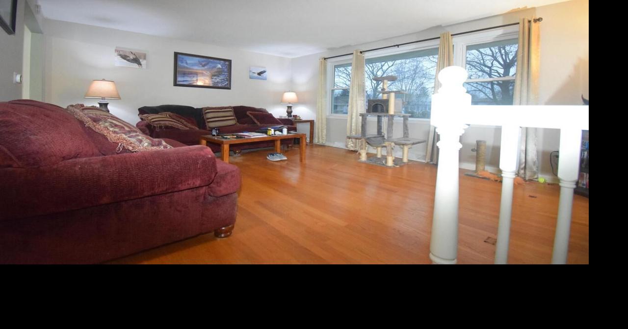 A 2 story home with a sunken foyer. Living room, kitchen and dining ...