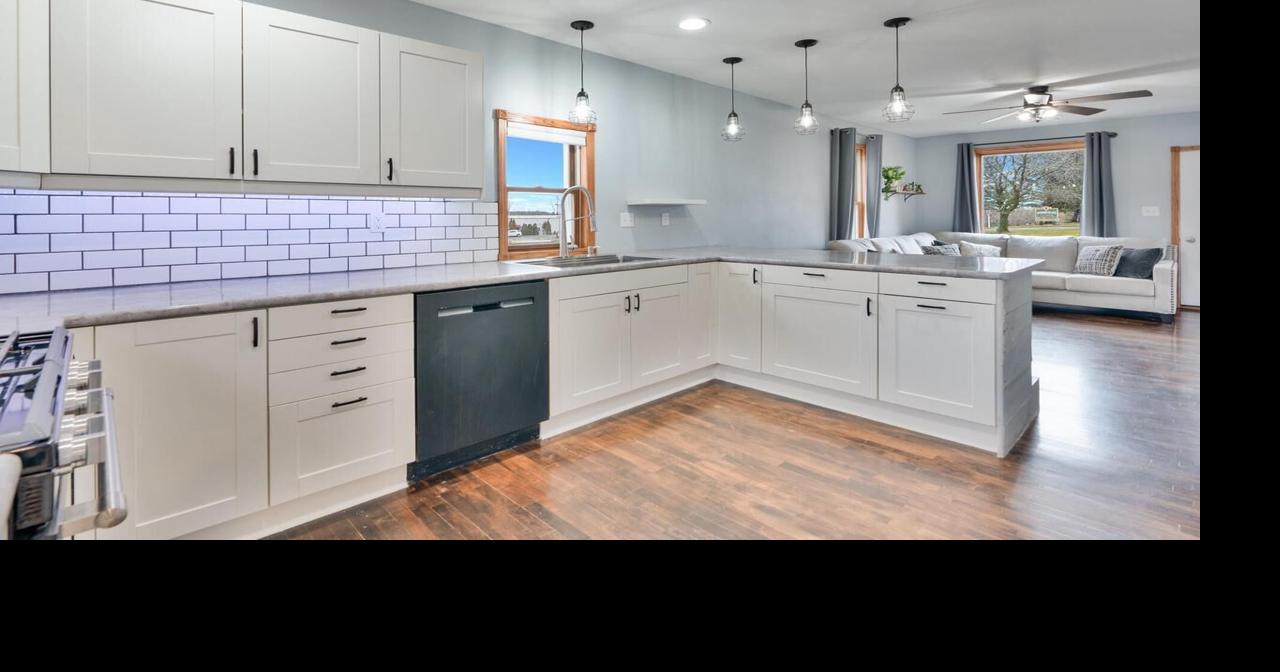 The kitchen & first floor bath are updated with a huge laundry room ...