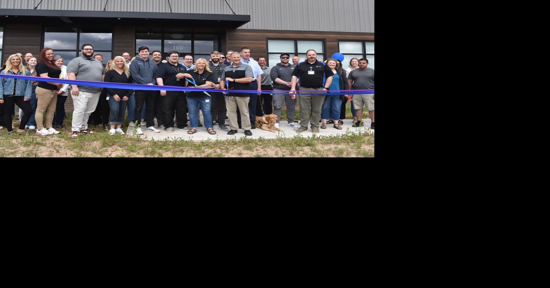 Officials and employees from Pros 4 Technology hold ribbon cutting and ...