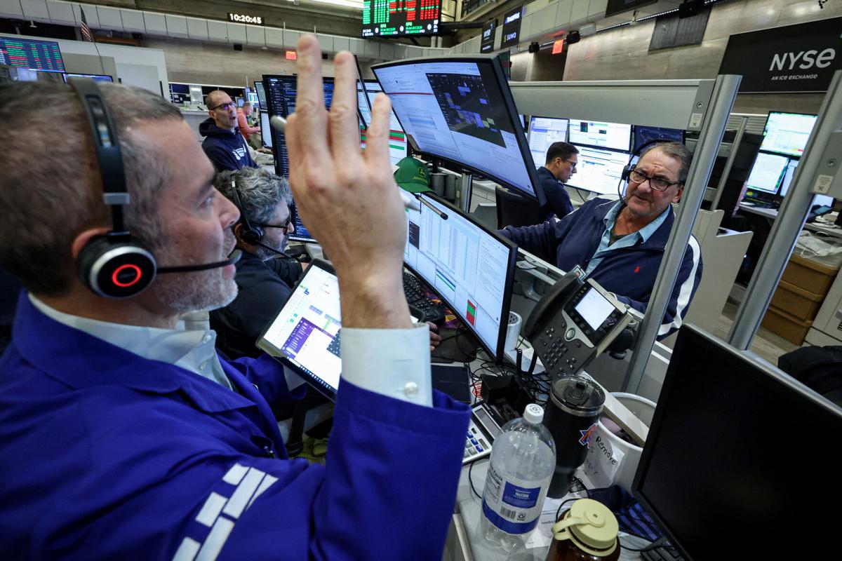 Stocks edge a bit below their latest records on Wall Street | Business ...