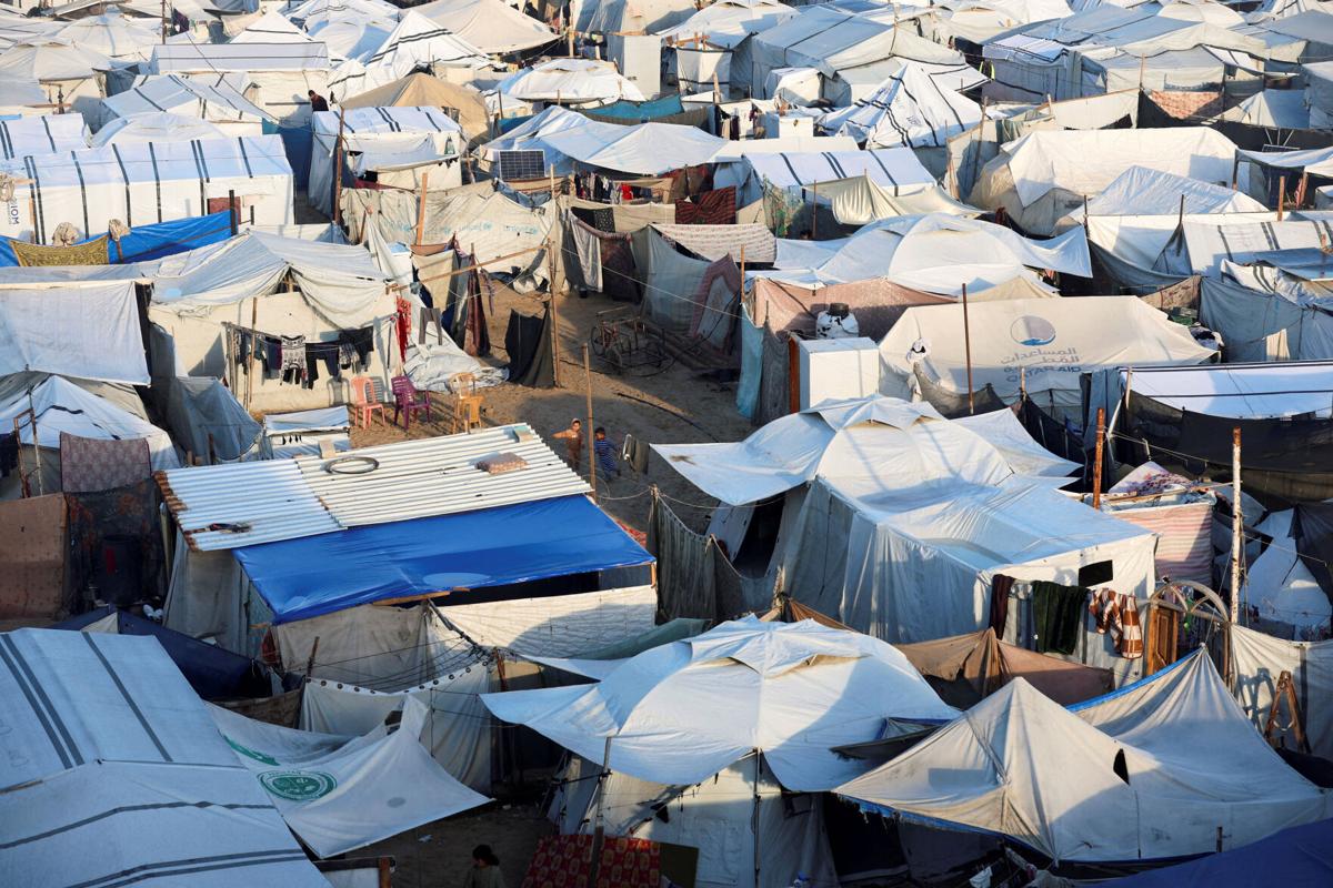 Israeli forensics experts examine remains handed over by militants in ...