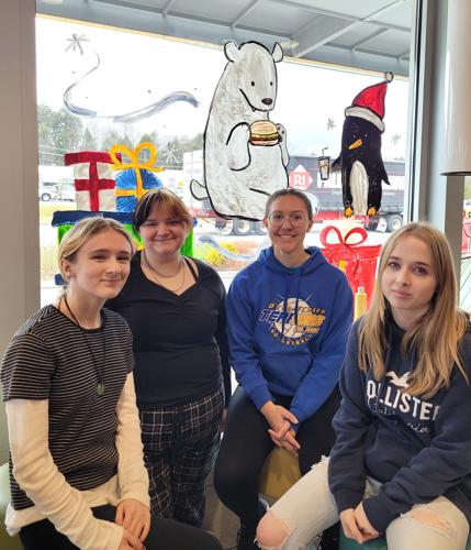 Spreading Christmas cheer through window painting | News | smdailypress.com