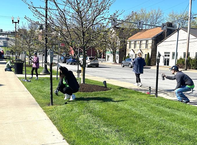 Community members lend a hand with downtown cleanup project | News ...