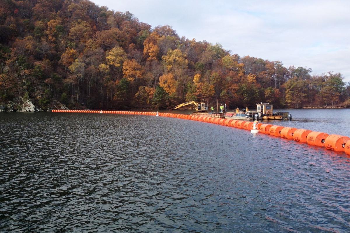 New floating barrier protects boaters from dam
