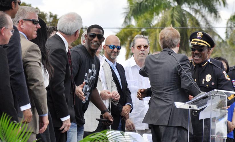 Hundreds of residents came out to salute the grand opening of the brand ...