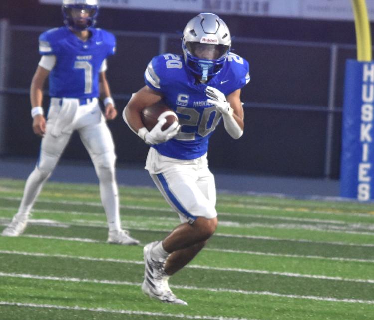 Huskies fall to Cougars in season opener, suffer 1st loss at new field ...