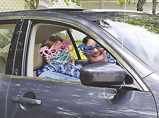 ALC students and their families celebrate graduation outside district ...