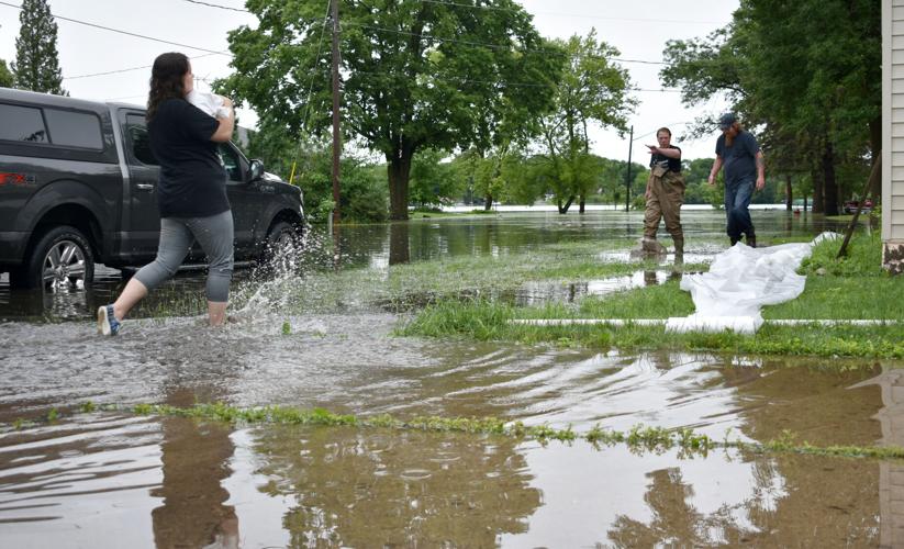 Local communities deal with flooding as rains pour in | News ...