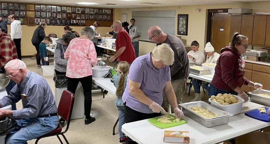 Families serving families a tradition at free community Thanksgiving ...