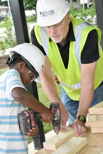 Met-Con helps STEAM students build picnic tables for new playground ...
