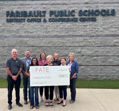 FATE presents check to help with Faribault School Supplies for All ...