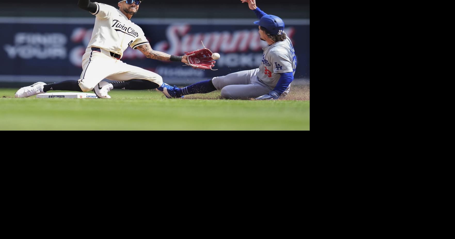 Twins stop slide on Julien's homers, Correa's throw to nab Ohtani at ...