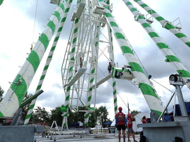 Reinventing the wheel: As State Fair opens, giant ride rises again ...