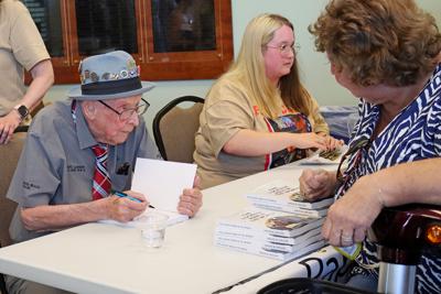 Papa Jake recounts war stories, signs books at SCHS | News ...