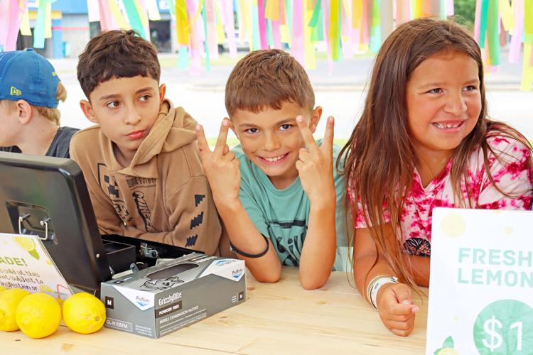 Summer school lemonade stand raising money for Transitional Housing ...