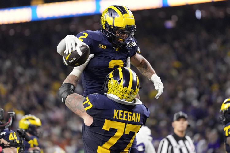 Michigan overpowers Washington 34-13 as Jim Harbaugh delivers a ...