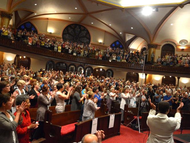 Communal choral event encourages audience singing to promote unity ...